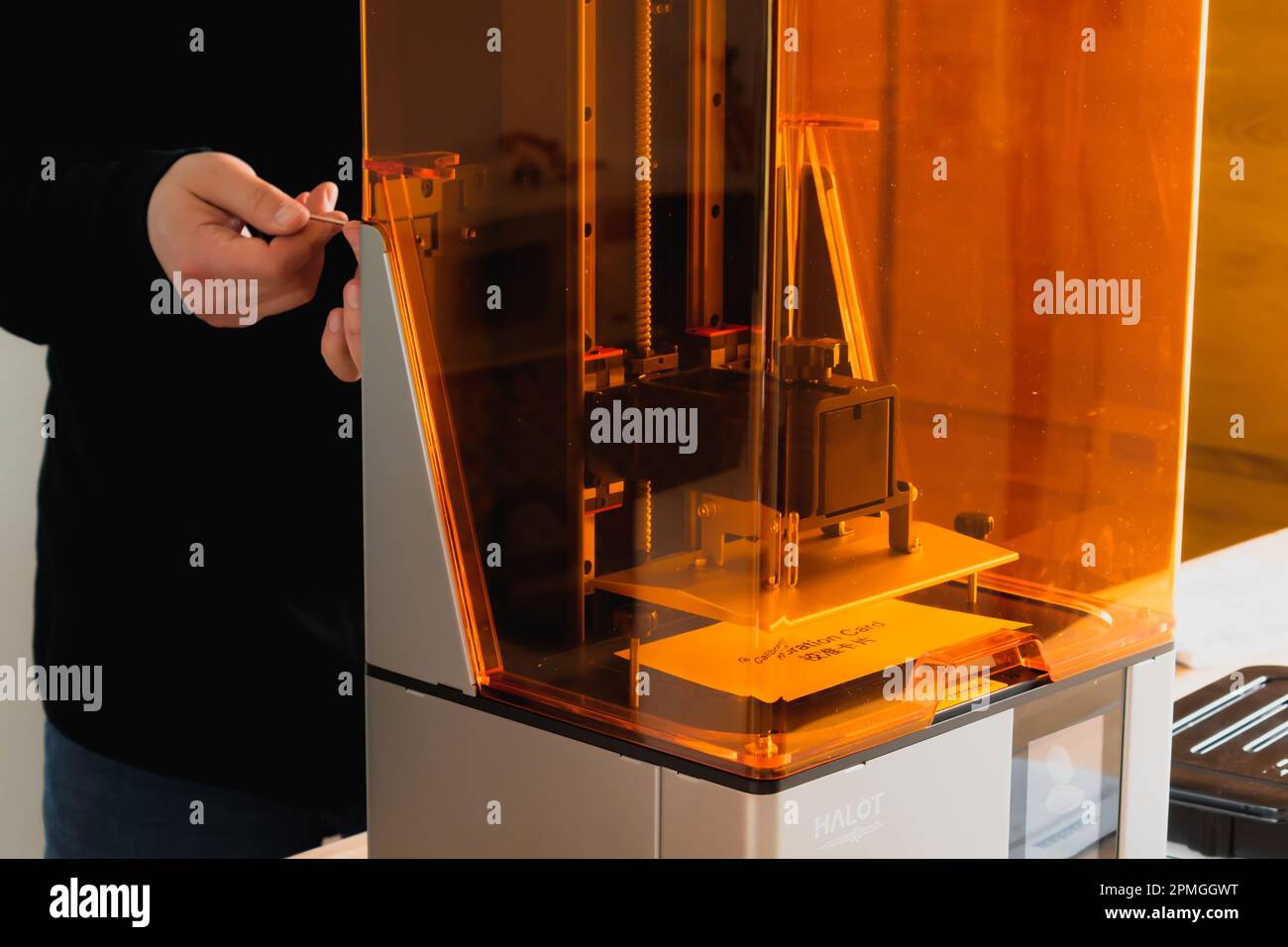 Man preparing a 3d resin printer before use Stock Photo - Alamy
