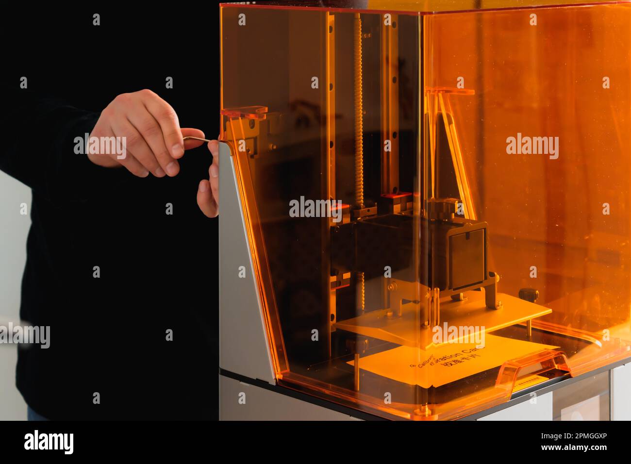 Man preparing a 3d resin printer before use Stock Photo - Alamy