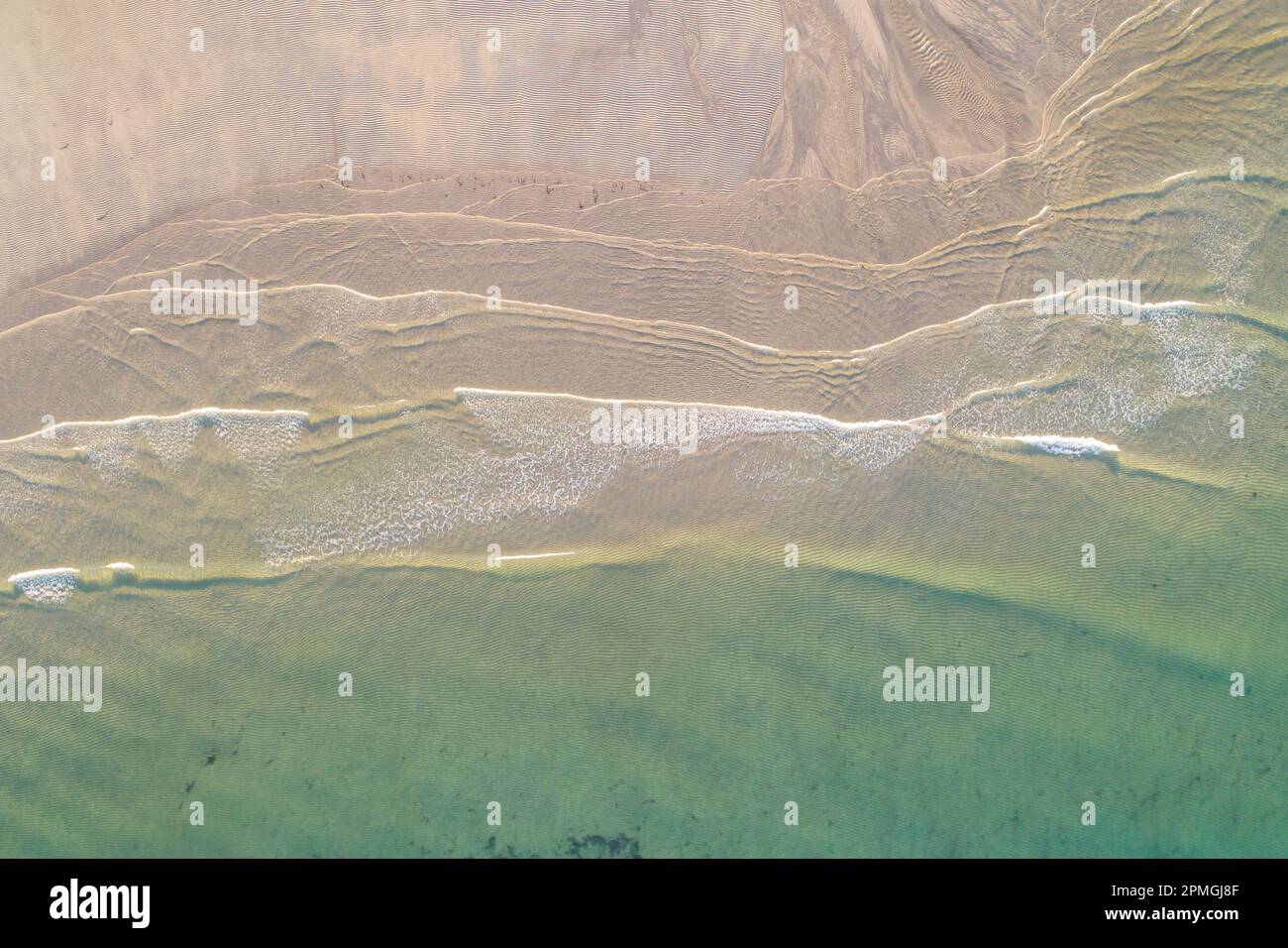 overhead drone aerial view of the waves on a beach shore Stock Photo ...