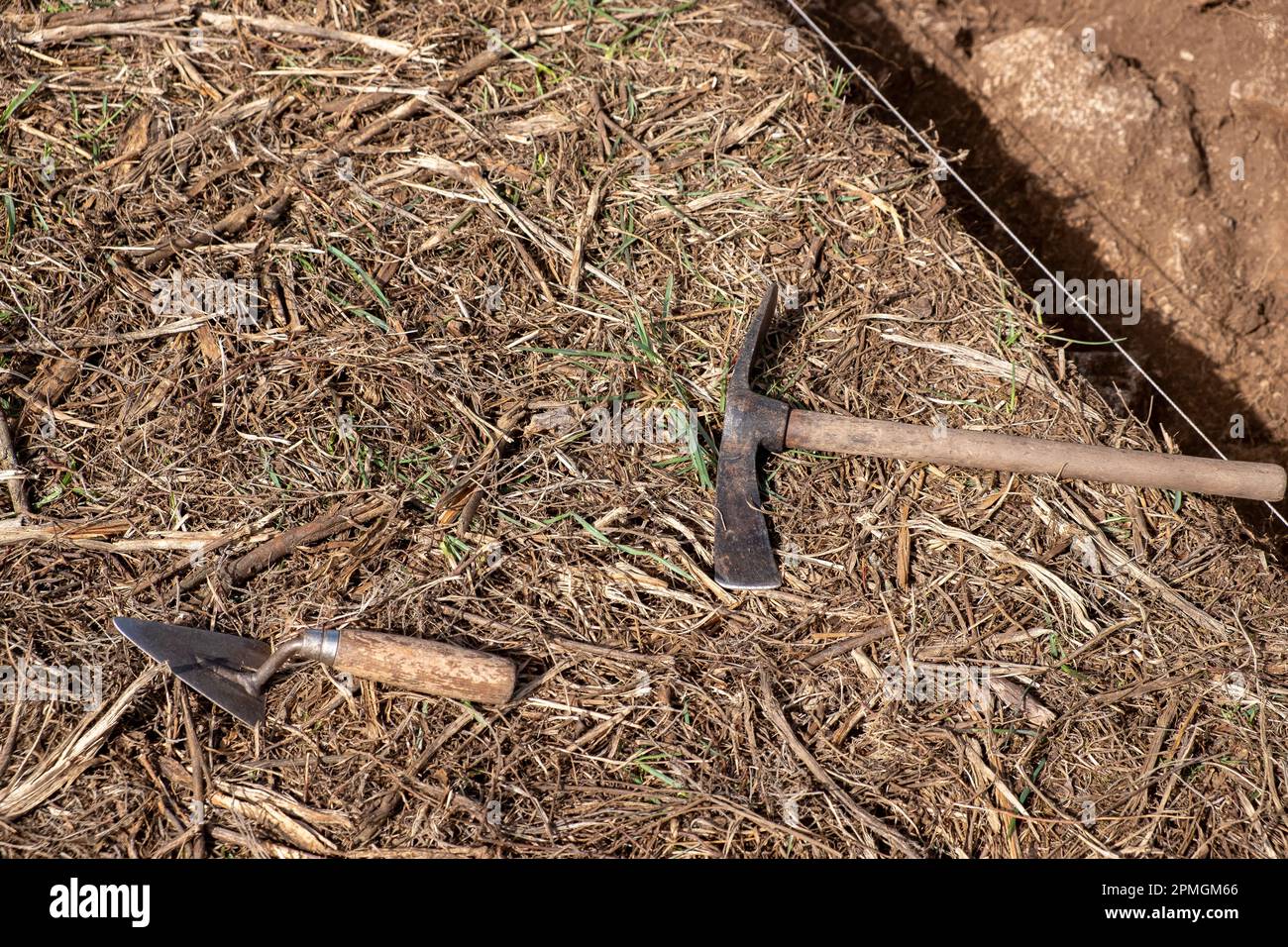 trowel and pickaxe in an archaeological excavation, work too Stock ...