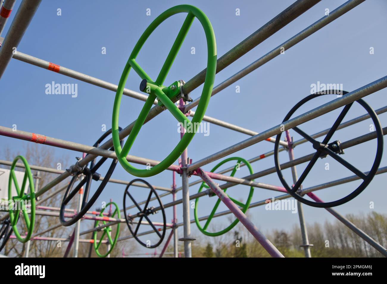 Hanging rings during an adventure obstacle course race Stock Photo - Alamy