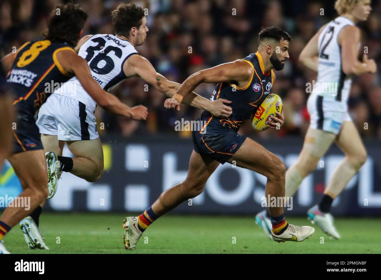 Wayne Milera of the Crows evades Josh Honey of the Blues during the AFL ...