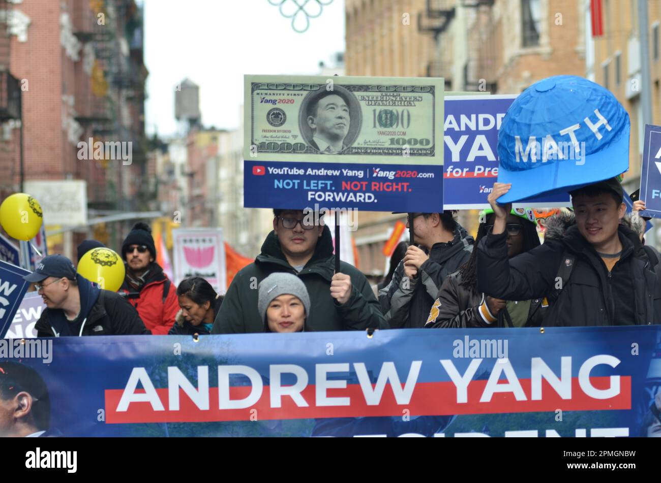 A group of people advertising for Andrew Yang for President during the ...