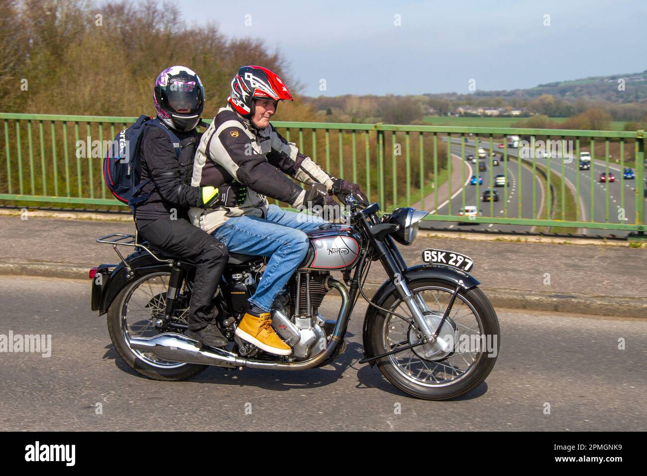 1954 50s fifties Black NORTON 496cc Petrol vintage motorcycle. Couple ...