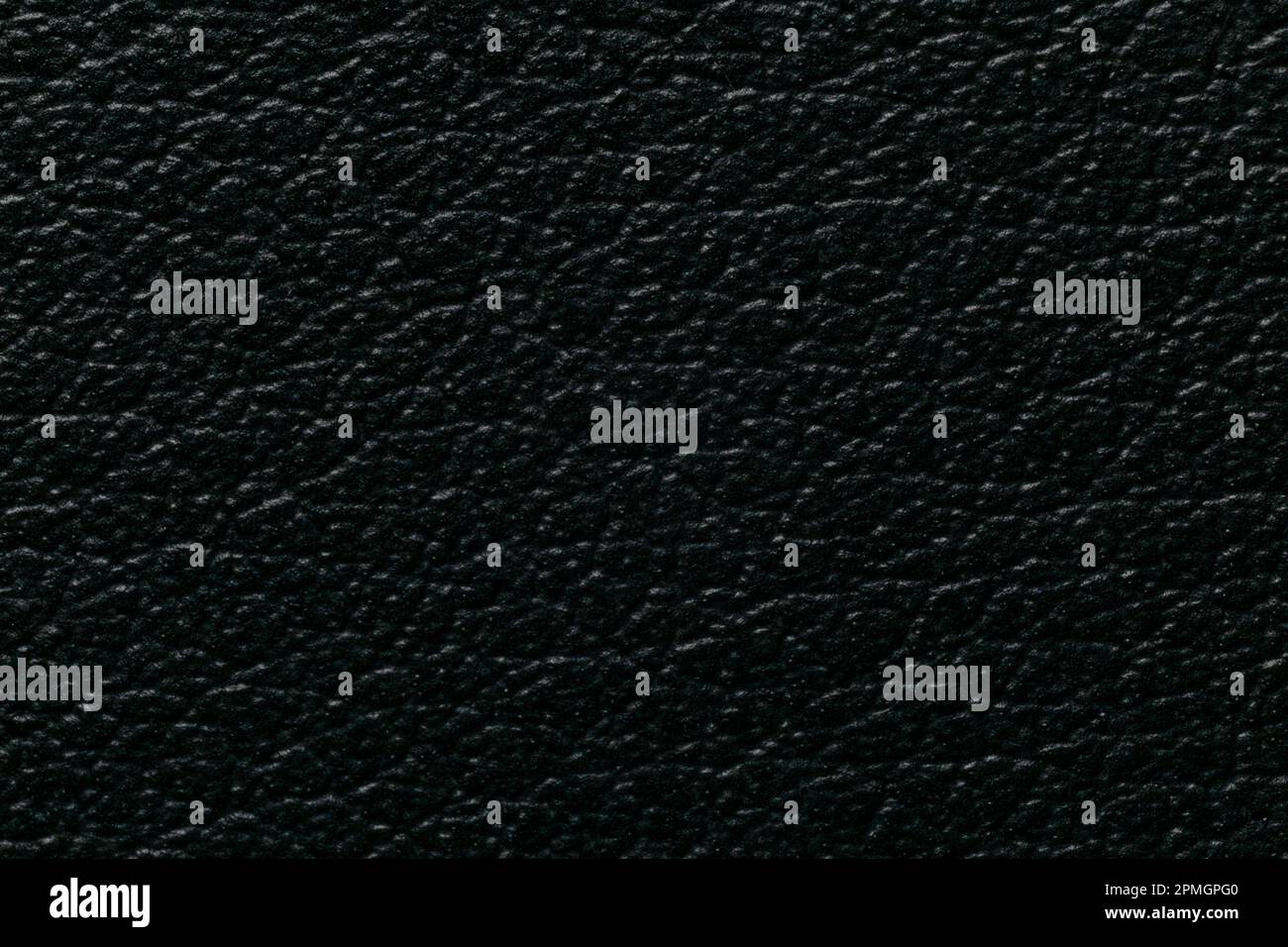 Black leatherette texture, eco-leather, extreme close-up macro view ...