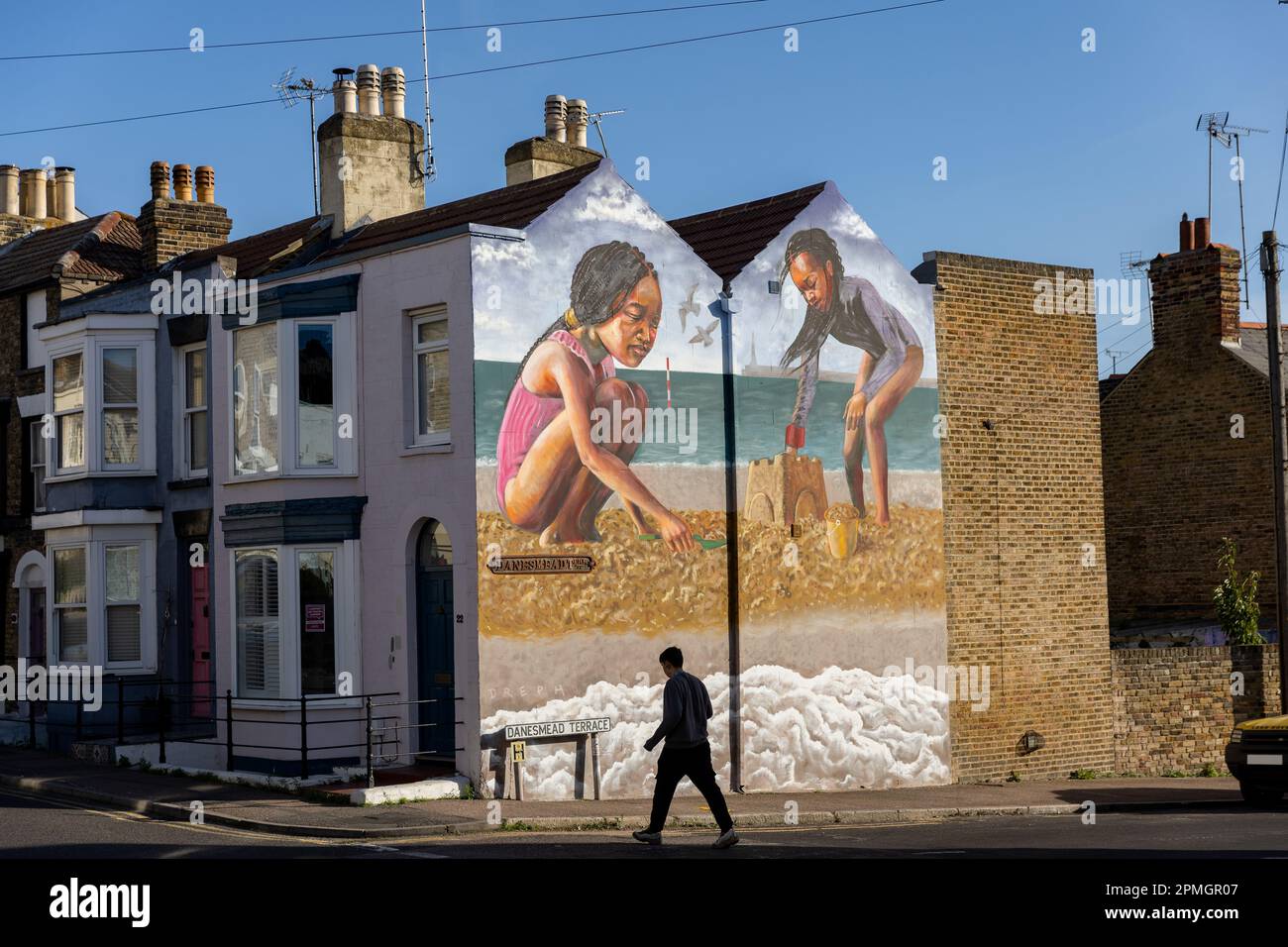 Street Art in Margate, Kent in the East of England, shows two young ...