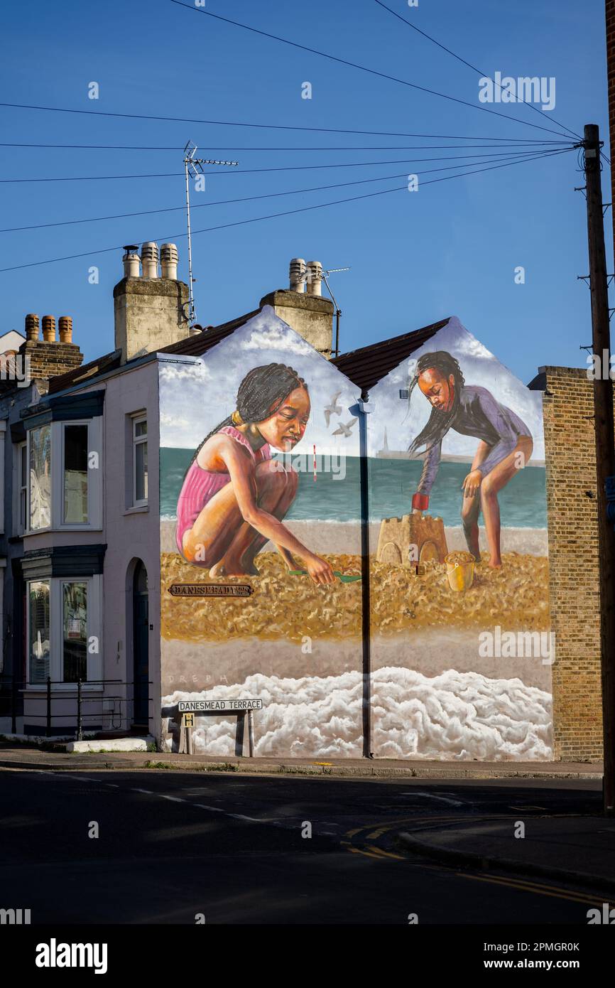 Street Art in Margate, Kent in the East of England, shows two young ...