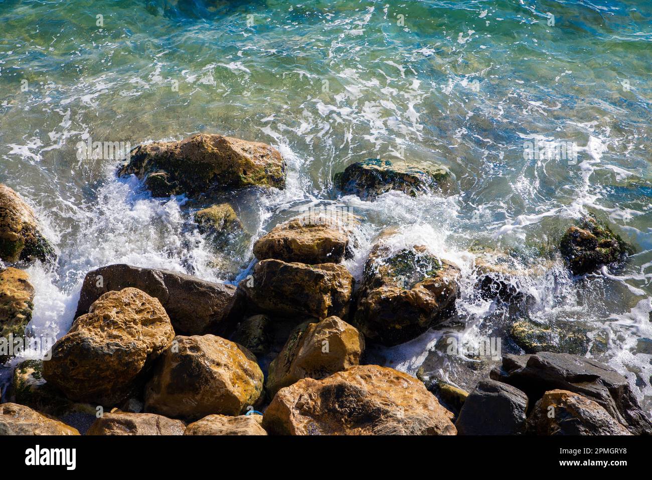 A top view with sea water among the stones on the shore, ocean Stock ...