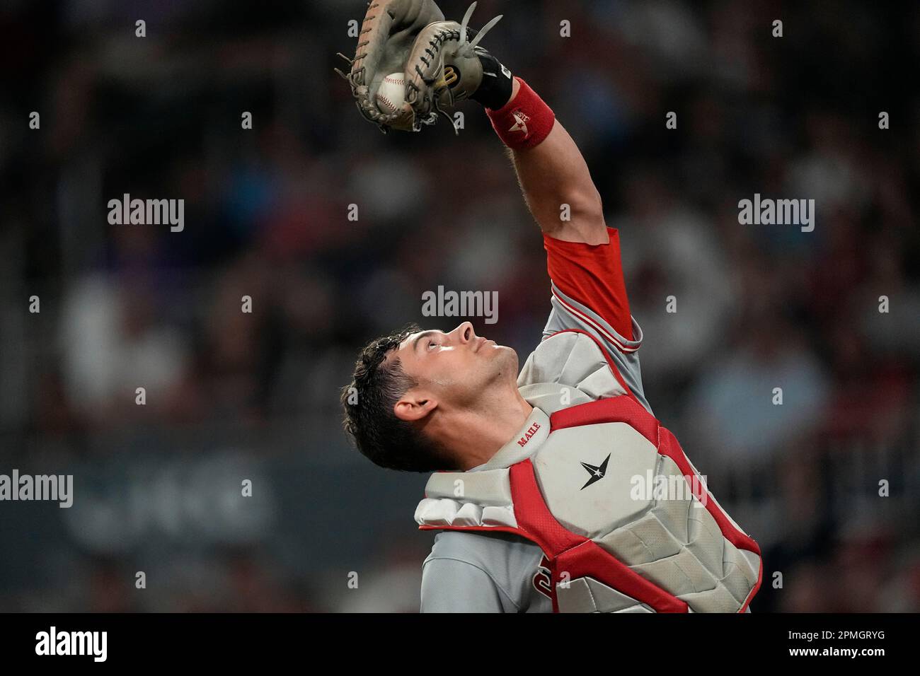 Cincinnati Reds catcher Luke Maile (22) makes a catch during a baseball ...