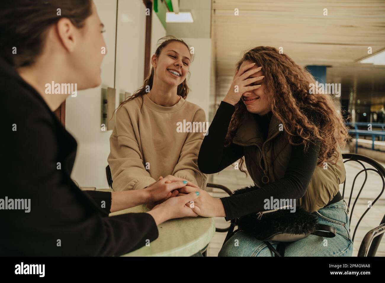 Curly haired girl slaps her forehead in oh-no moment. She cannot ...