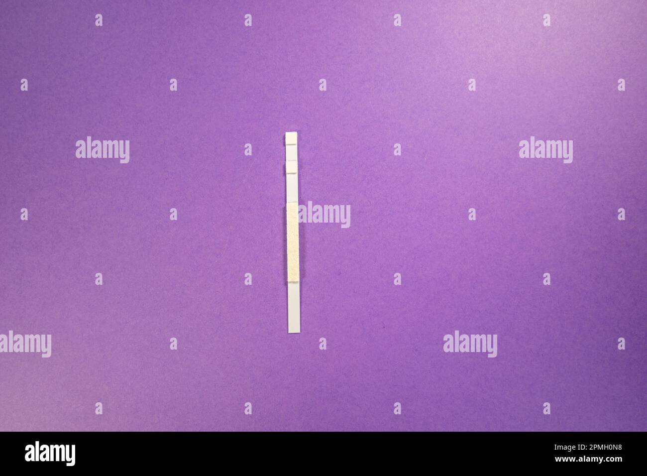 single phosphate test strip isolated on a purple background Stock Photo ...