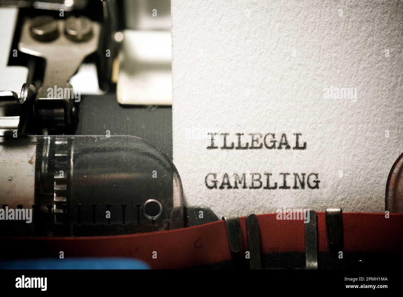 Illegal gambling text written with a typewriter Stock Photo - Alamy