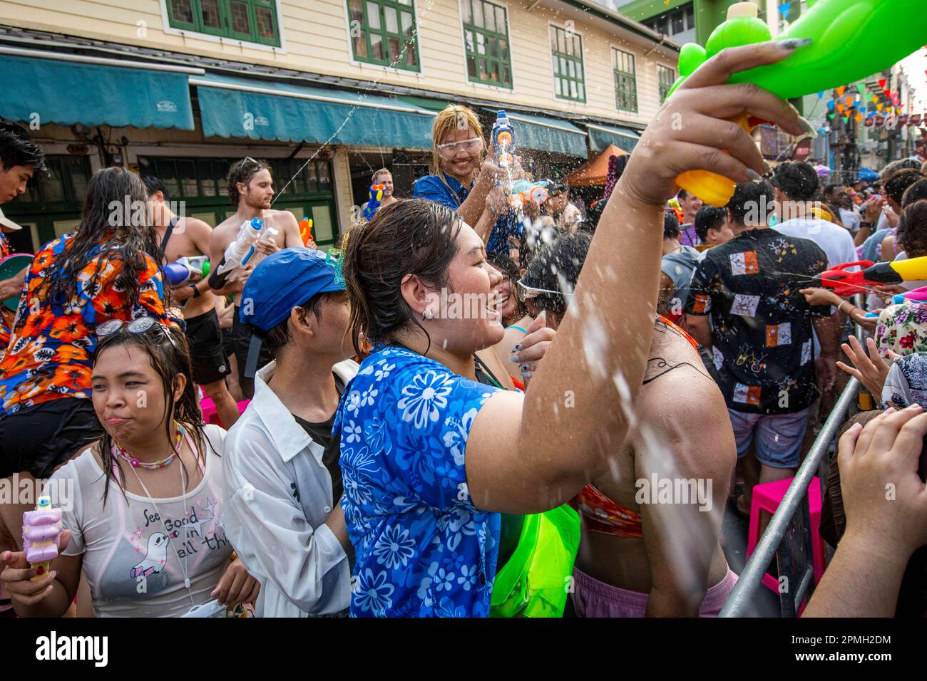 Bangkok, Bangkok, Thailand. 13th Apr, 2023. Revelers dance and blast each other with water guns ...