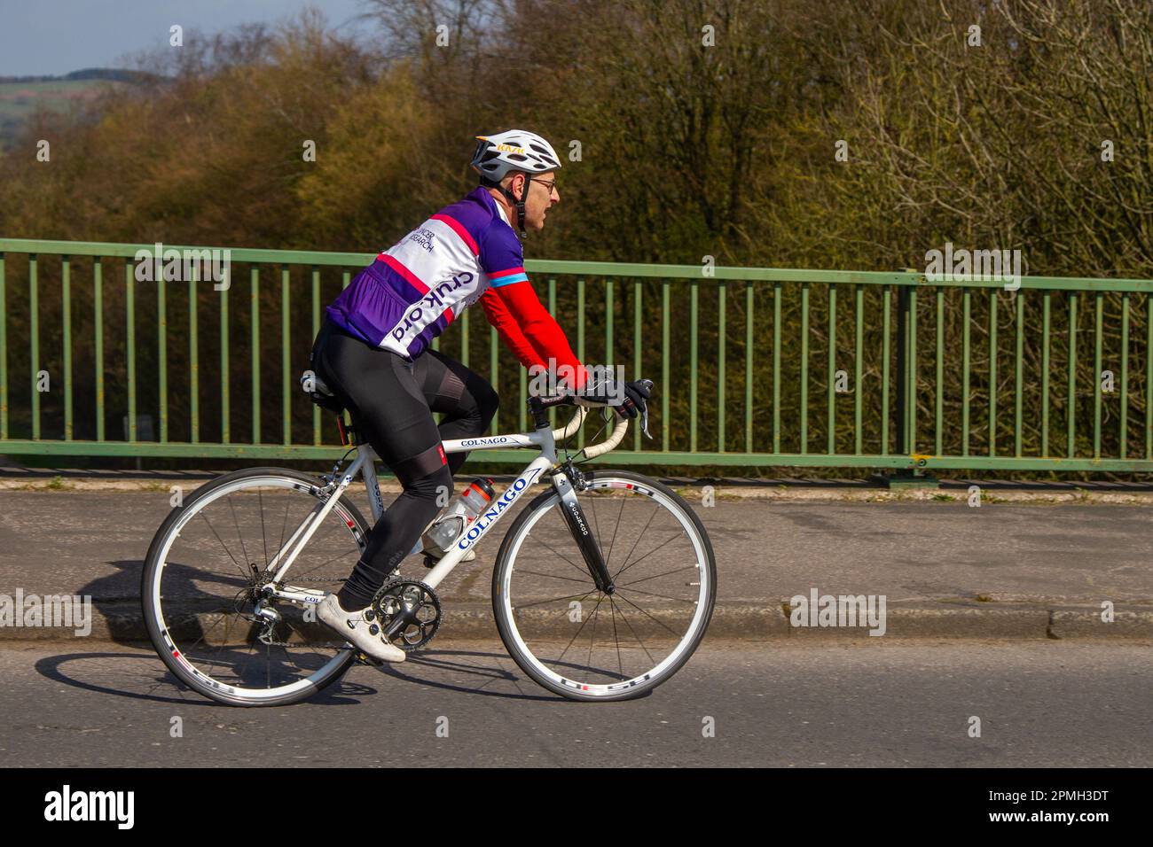 Male cyclist riding Planet X green sports road bike on countryside ...