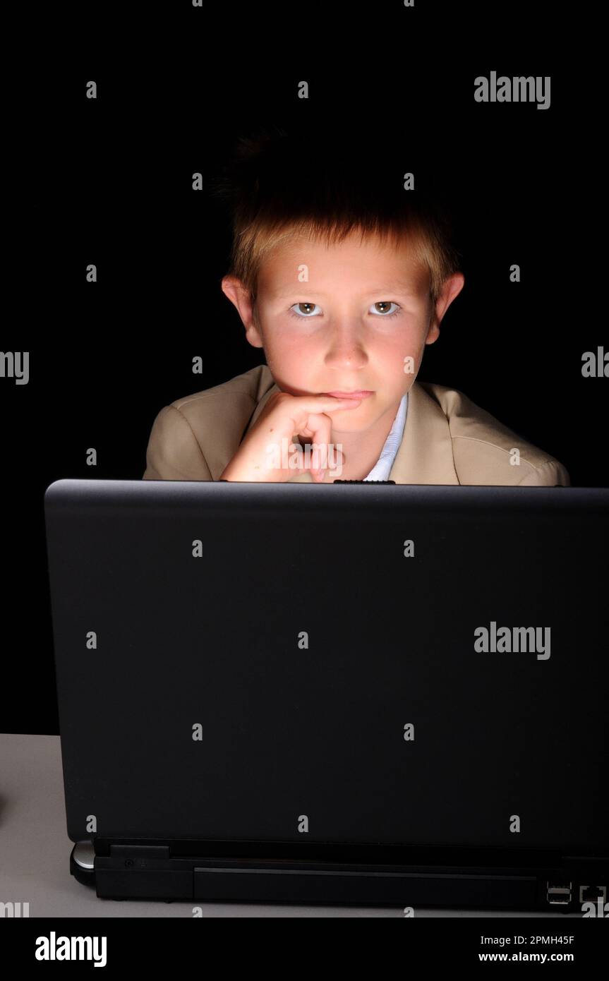 A Young boy businessman hard at work Stock Photo - Alamy