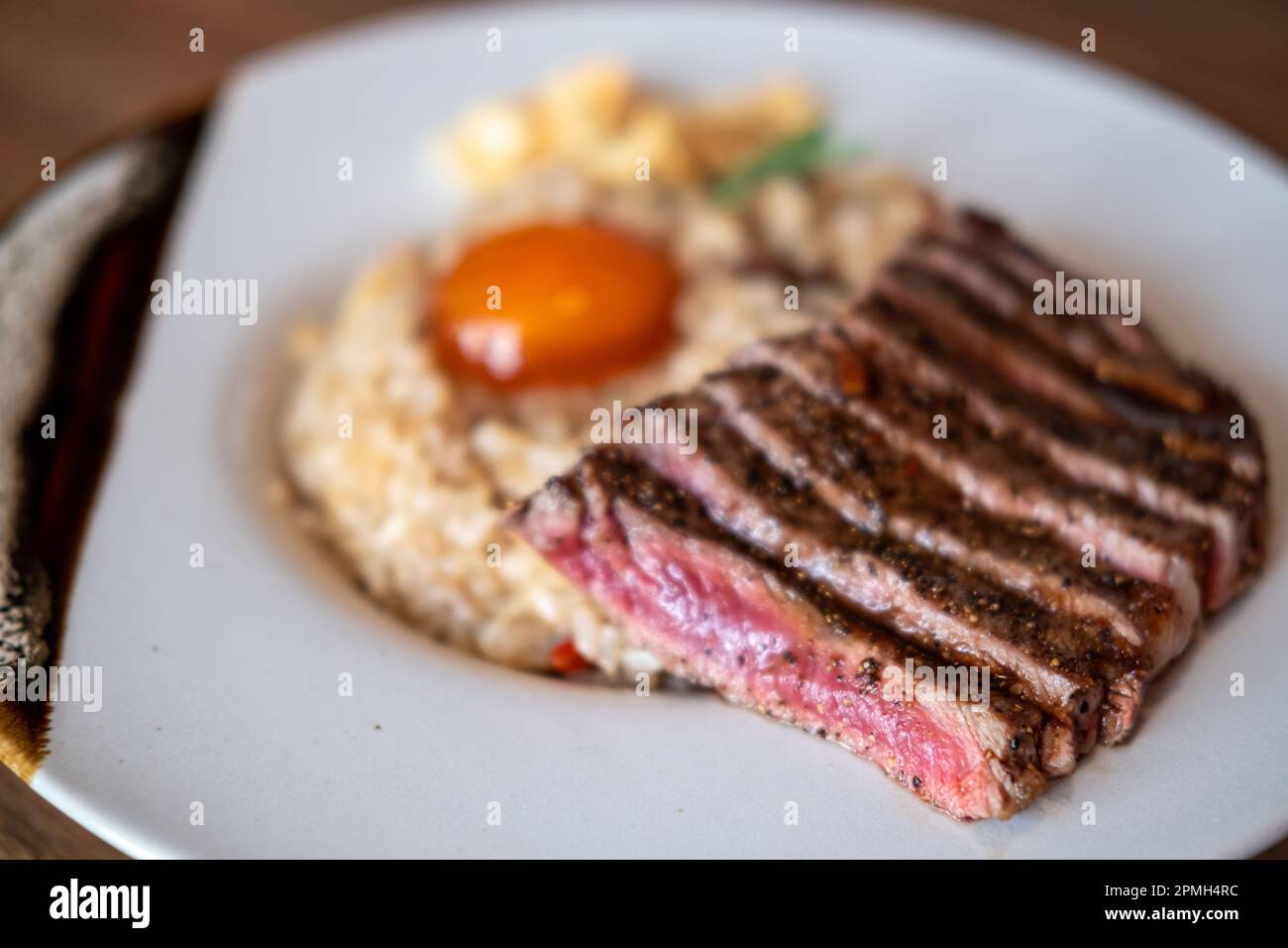 Beef with beef fat fried rice, a dish consisting of a bowl of rice ...