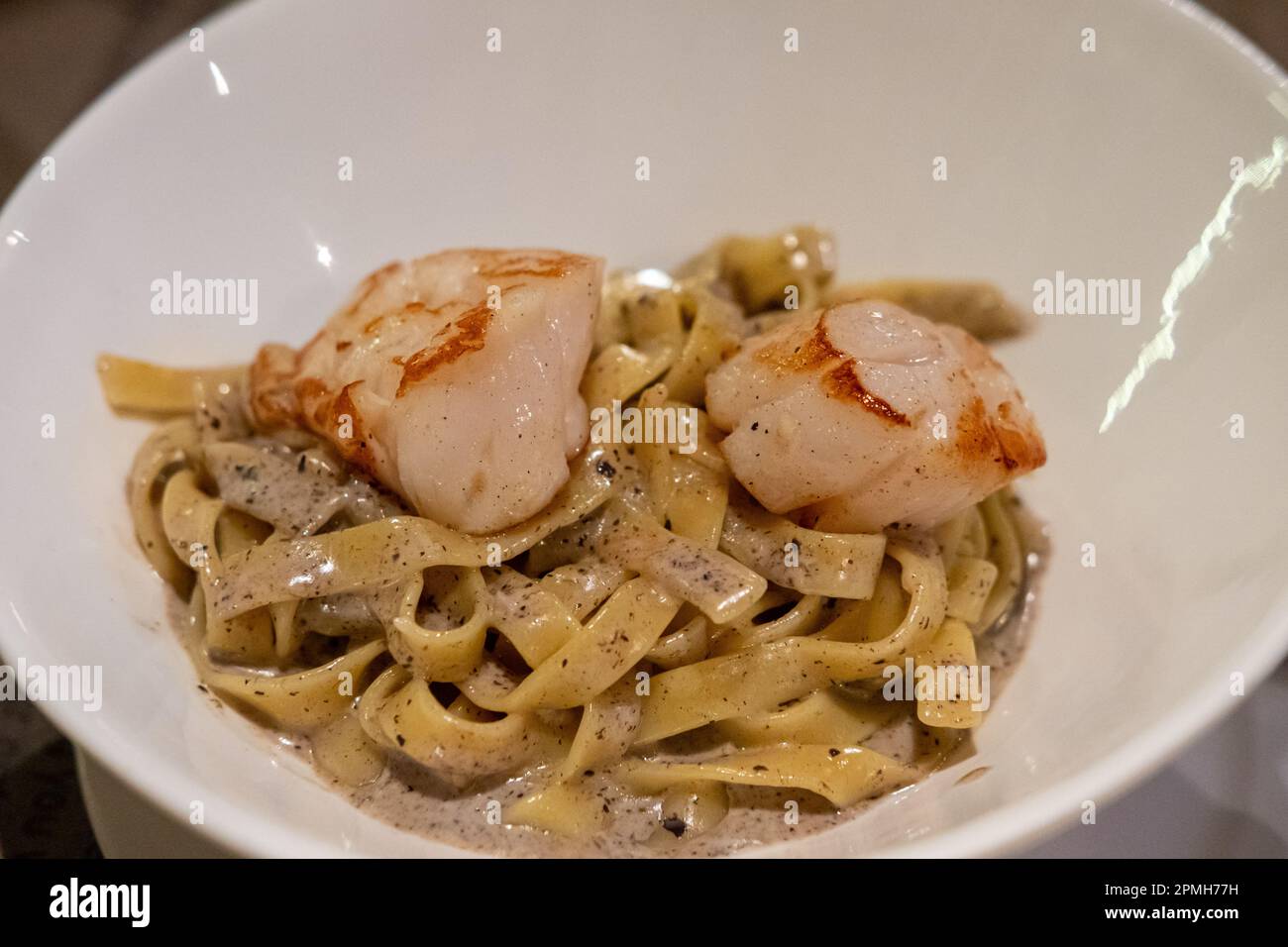 Truffle Scallops fettuccine served on plate in the restaurant Stock ...