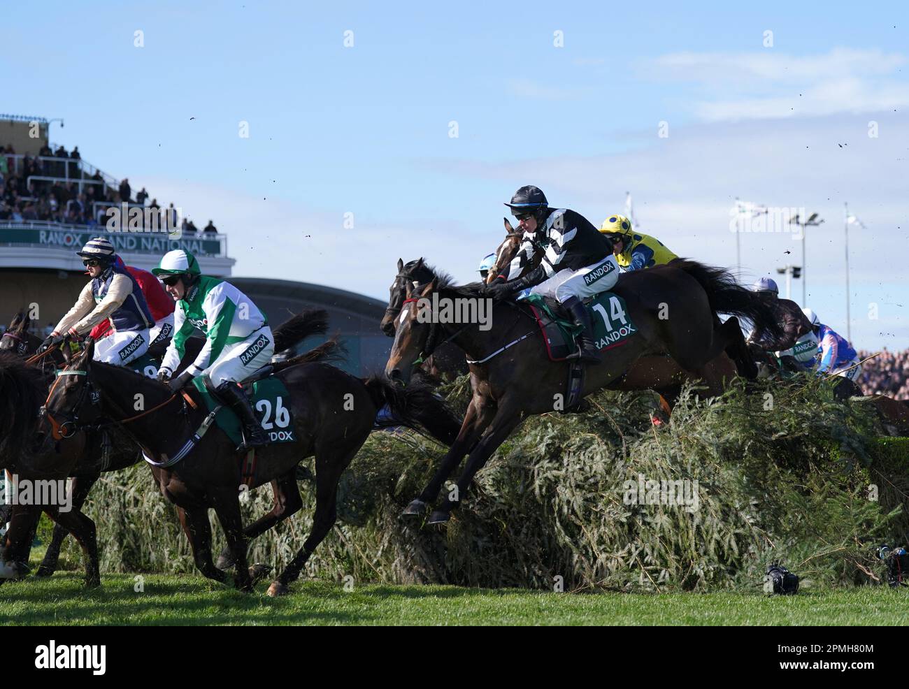 Its On The Line ridden by Derek O'Connor (right) clears a fence in the ...