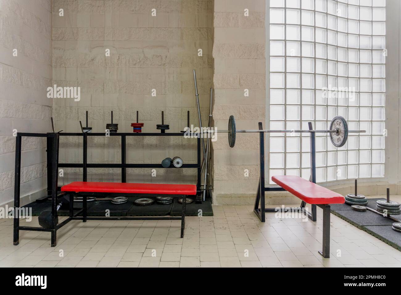 Old and worn gym machines on an empty place Stock Photo - Alamy