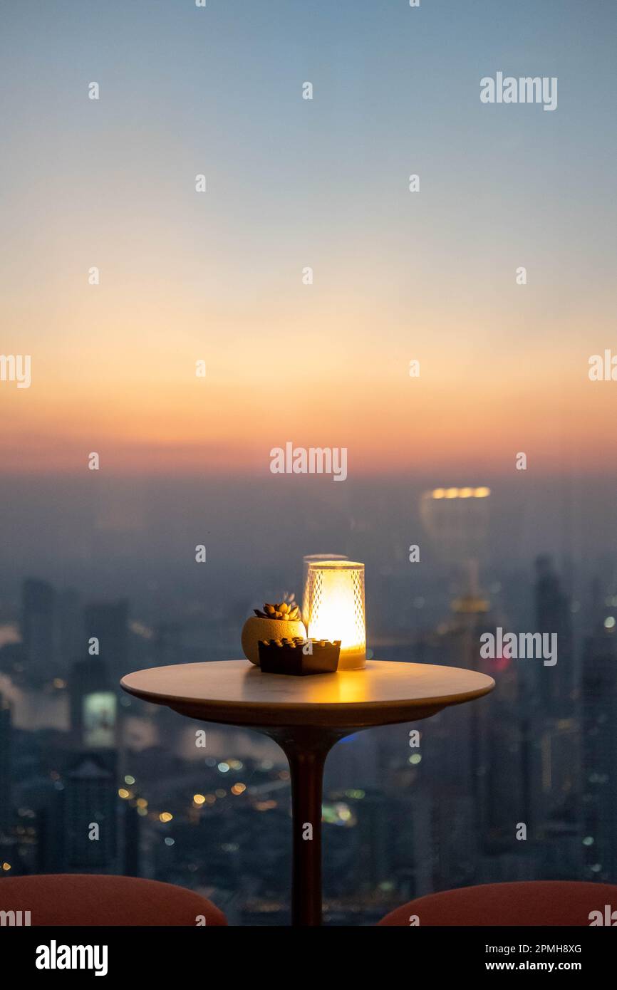 Seating on the terrace of the restaurant with sky view during sunset ...