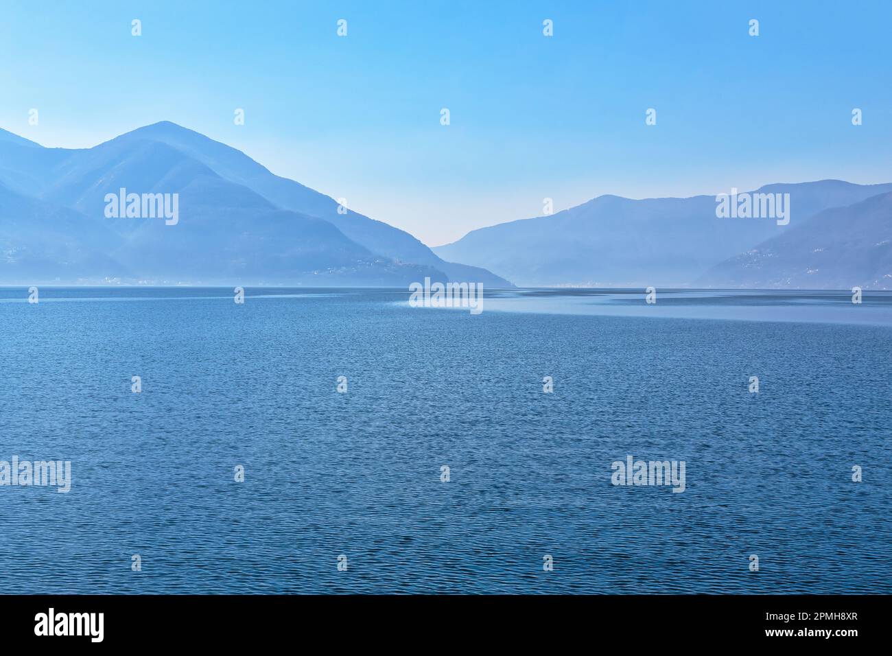 View to beautiful Lago Maggiore surrounded by blue mountains from ...