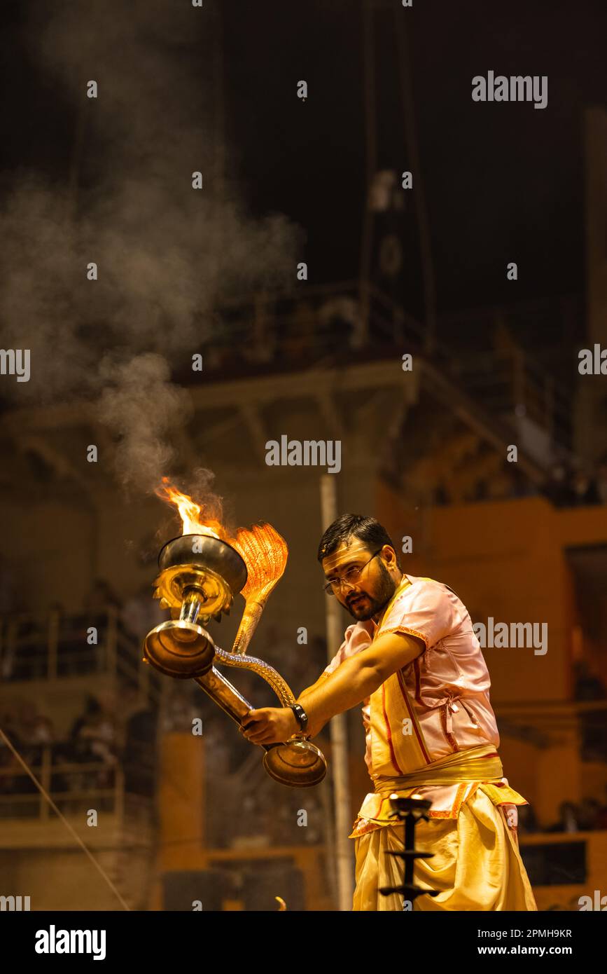 Ganga aarti, Portrait of an young priest performing river ganges ...