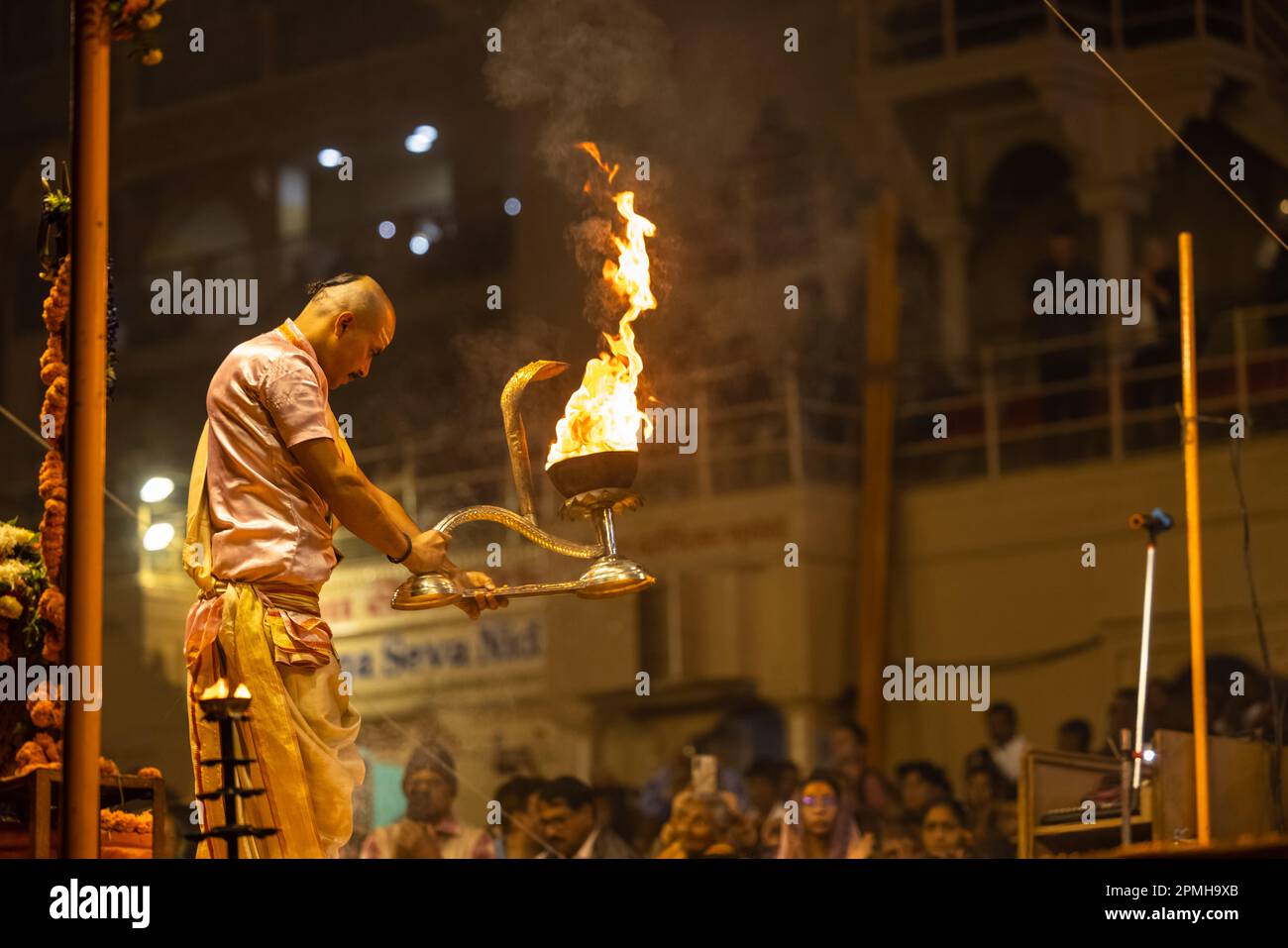 Ganga aarti, Portrait of an young priest performing river ganges ...