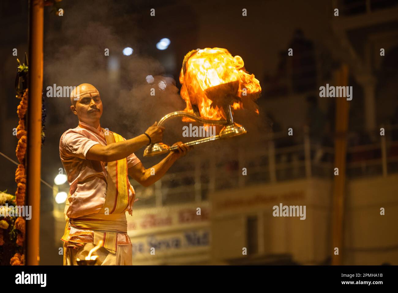 Ganga aarti, Portrait of an young priest performing river ganges ...