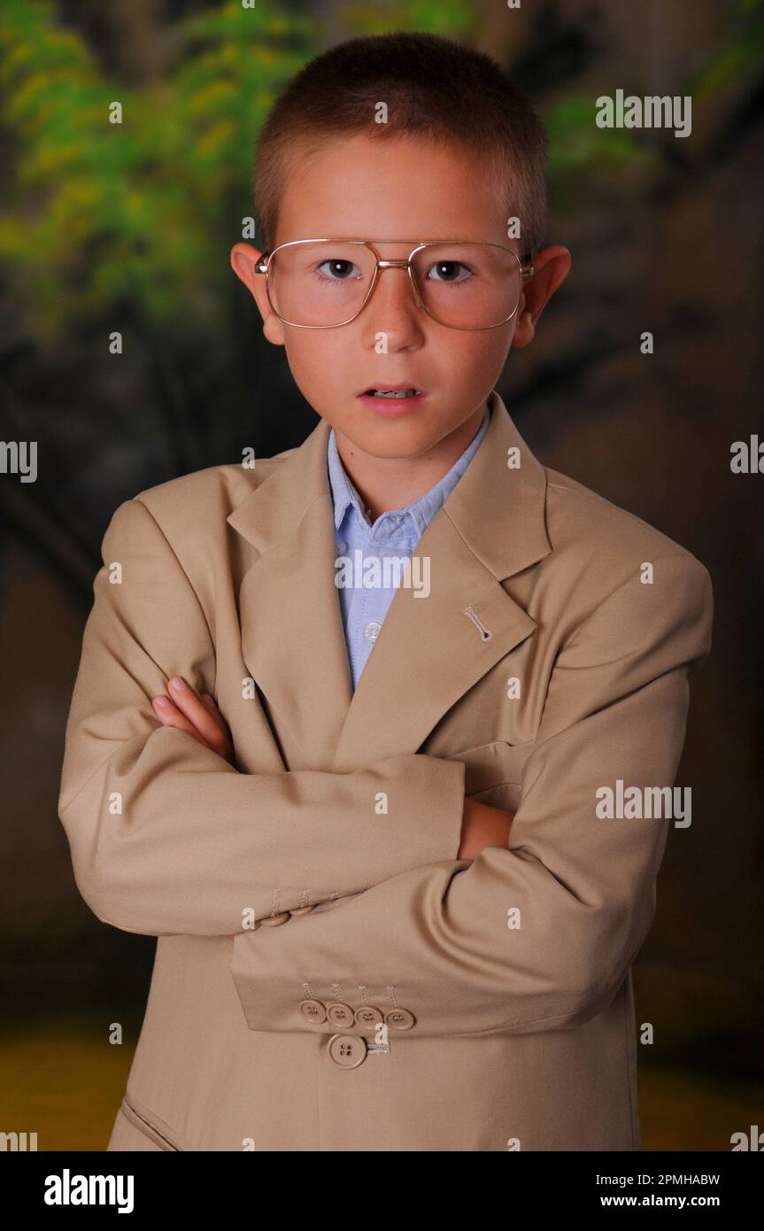 Young boy businessman dressed formally wearing a suit Stock Photo - Alamy