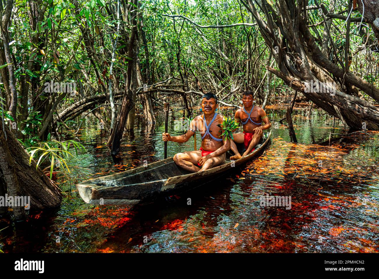 Men from the Yanomami tribe in a canoe, southern Venezuela, South ...