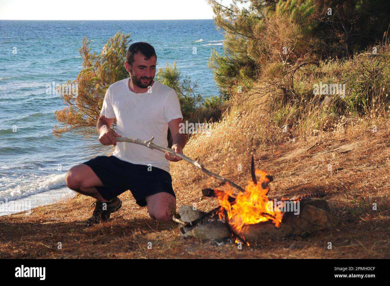 Campers burning fire in Turkey Stock Photo - Alamy