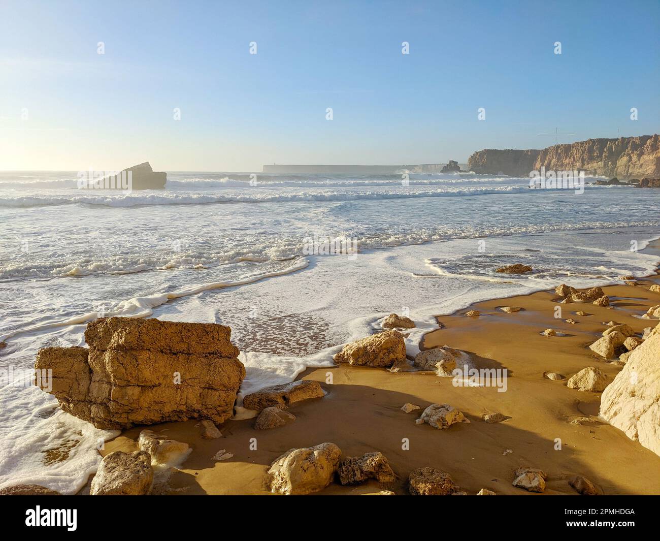 Ocean landscape with sand and rocks on the beach. Sagres, Algarve ...