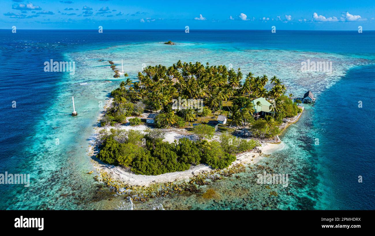 Aerial of a little island at the Avatoru Pass, Rangiroa atoll, Tuamotus ...