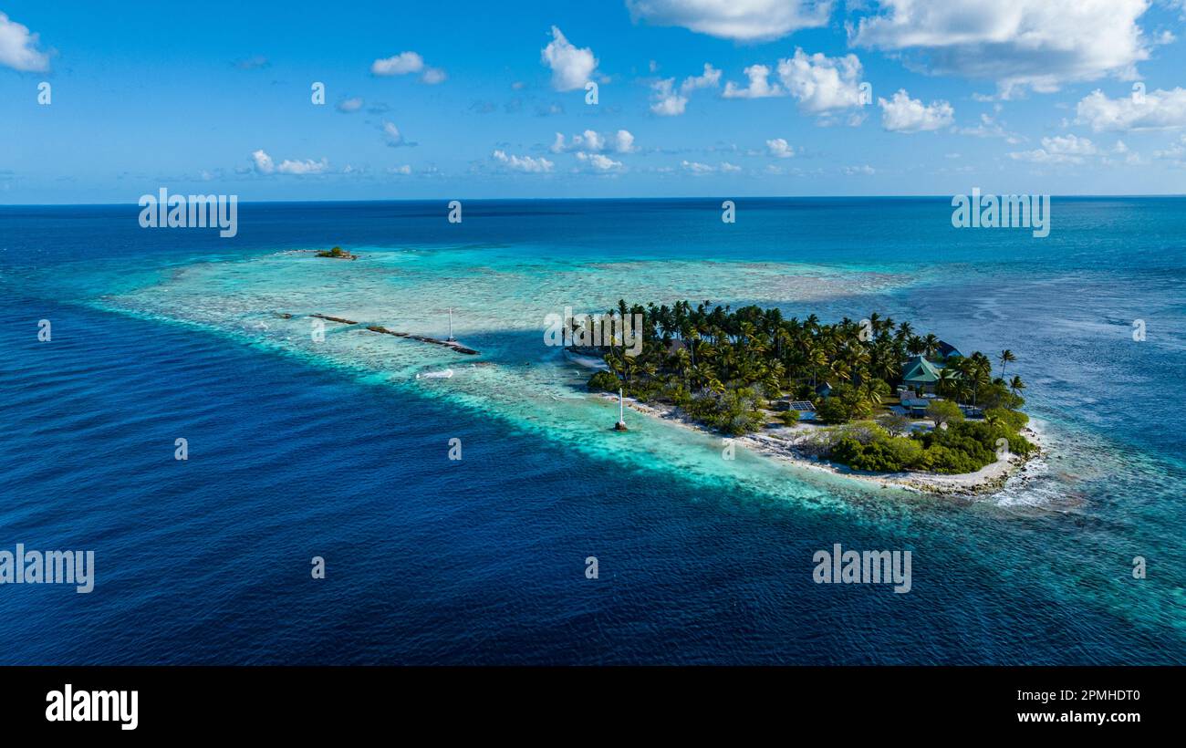 Aerial of the little island at the Avatoru Pass, Rangiroa atoll ...