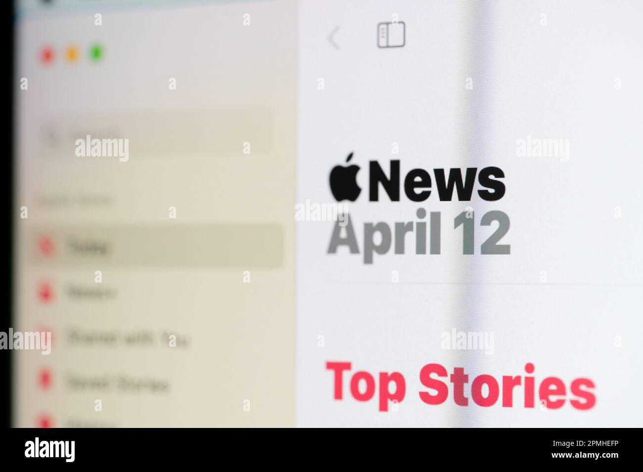 New york, USA - April 12, 2023: Reading Top Stories in apple news on ...