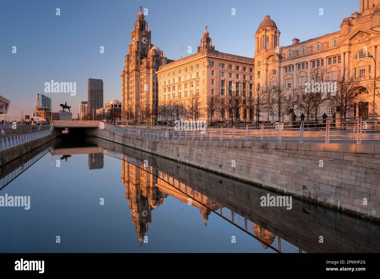 Evening light illuminates the Liver Building, the Cunard Building and ...