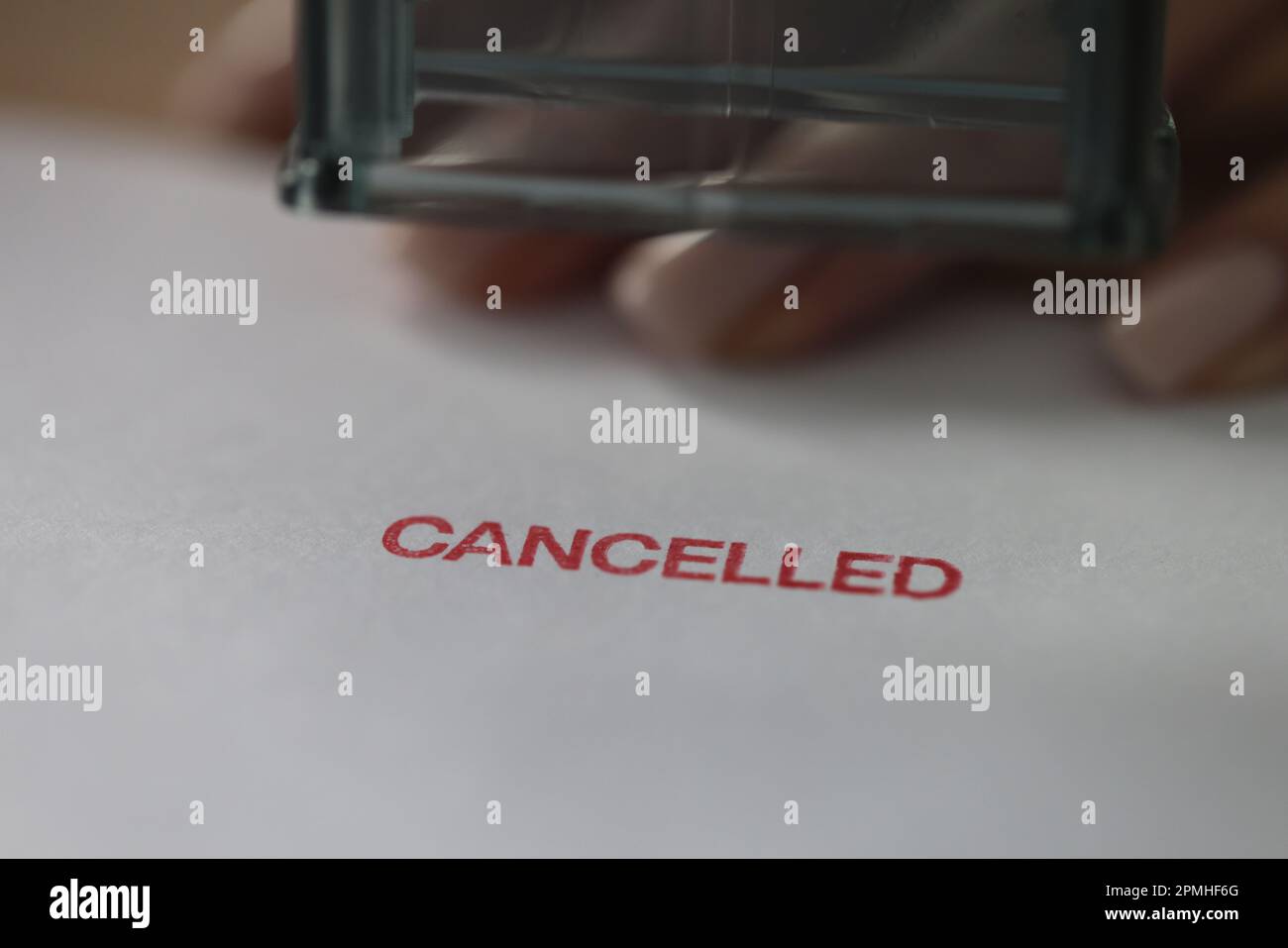 White paper with word Cancelled under banking terminal Stock Photo - Alamy