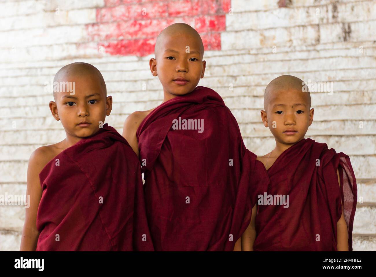 Three novice monks looking at camera, Mandalay Hill, Mandalay, Myanmar ...