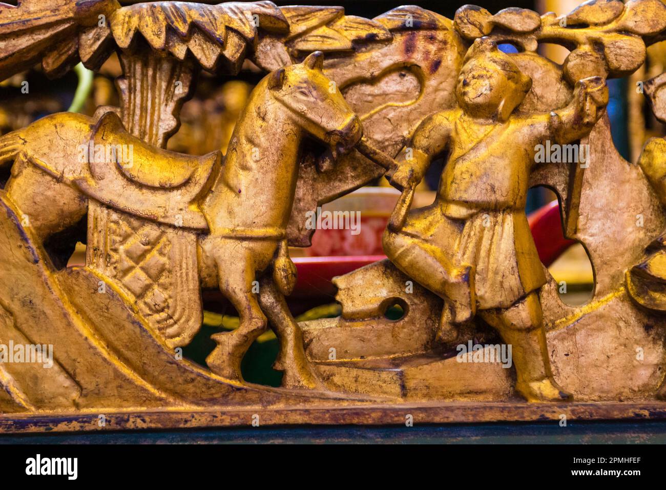 Detail of metallic decoration portraying horse and knight inside temple ...