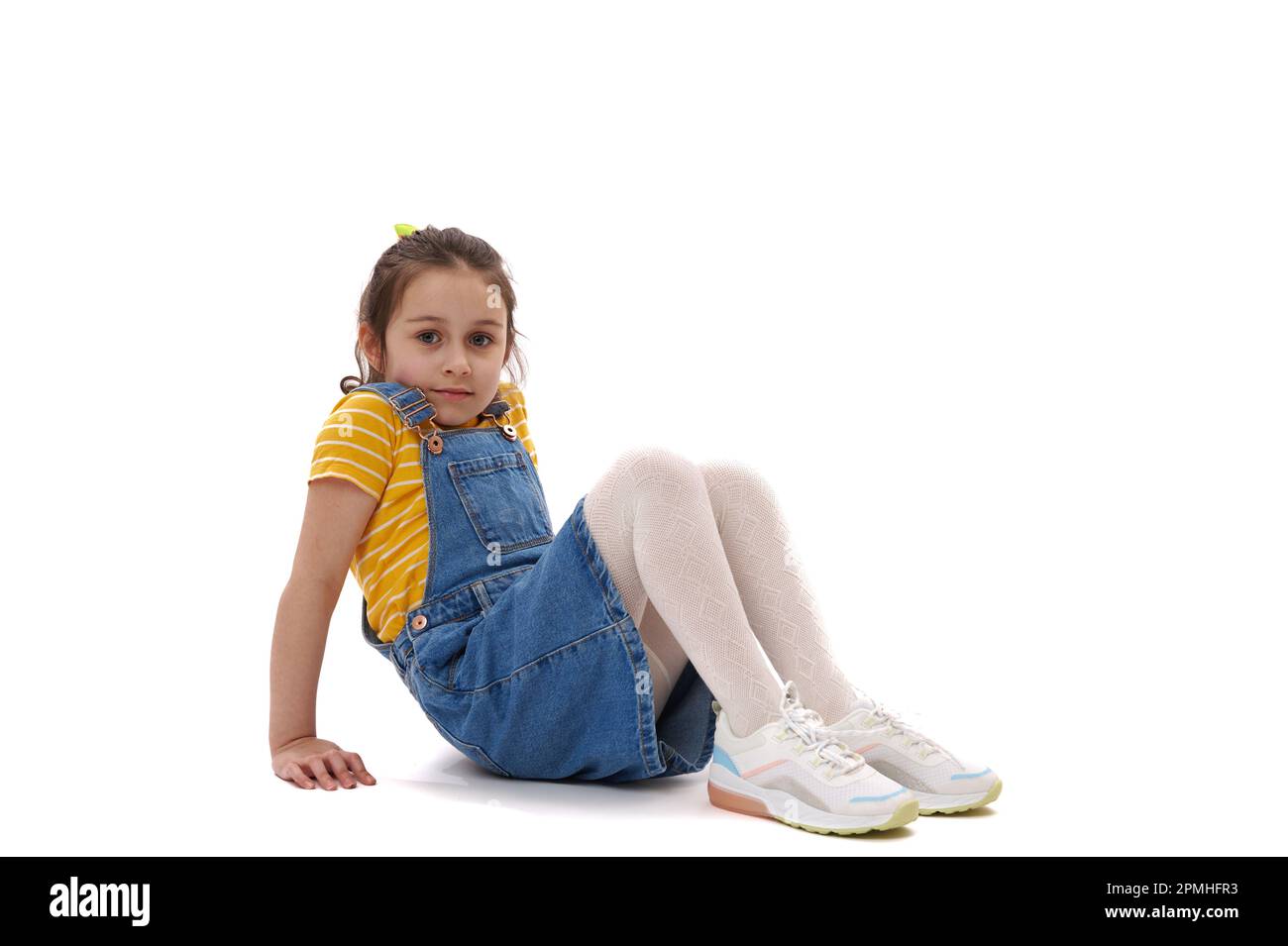 Adorable little child girl, elementary aged little girl, looking at ...