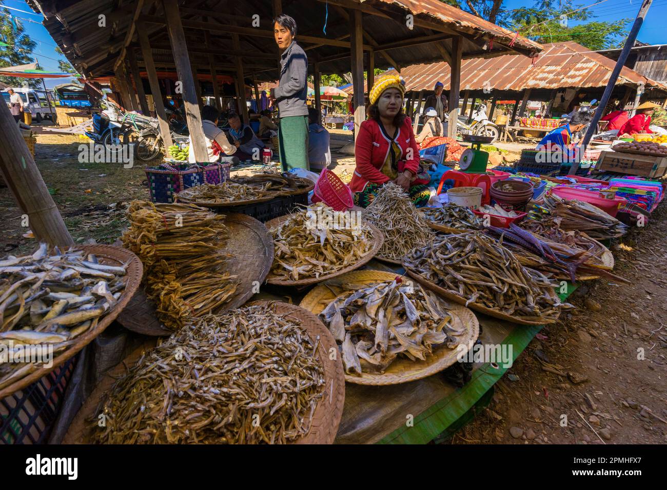 Vendors selling dried fish at market, Inn Thein, Lake Inle, Shan State ...