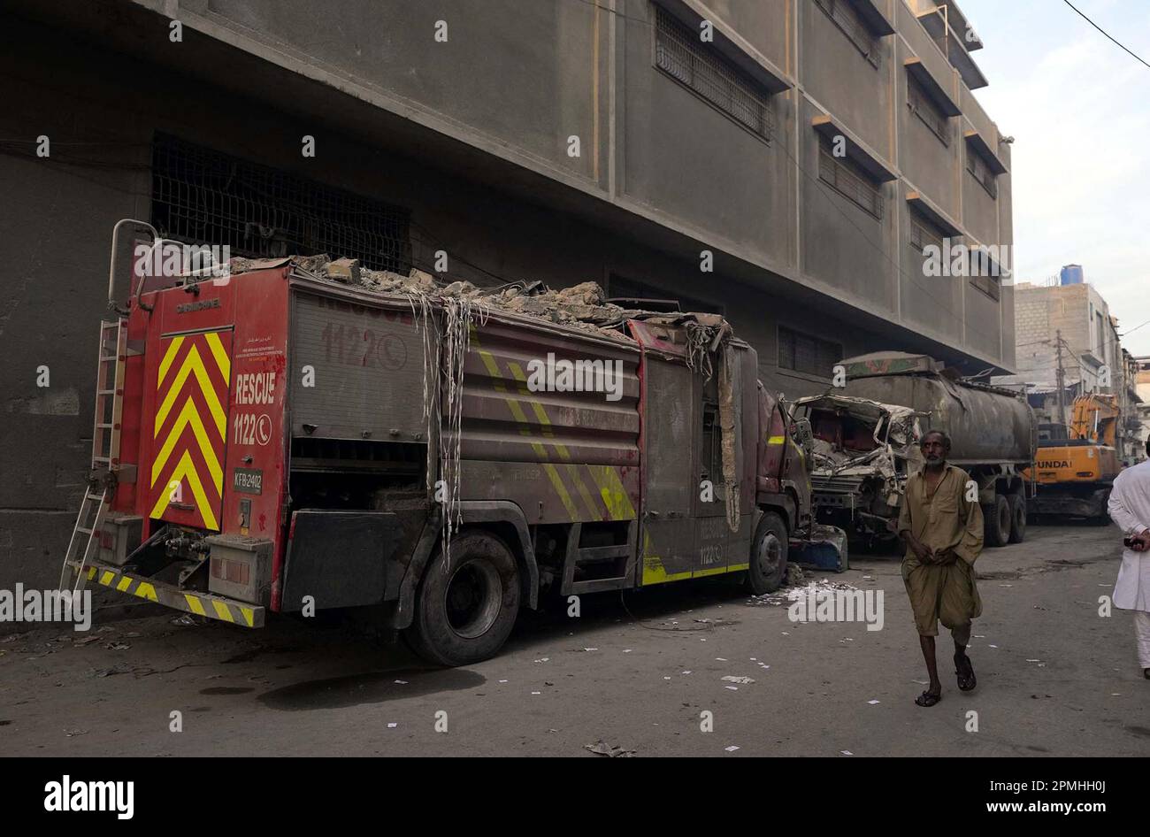 Peshawar, Pakistan, April 13, 2023. Rescue officials are busy in rescue operation after a ...