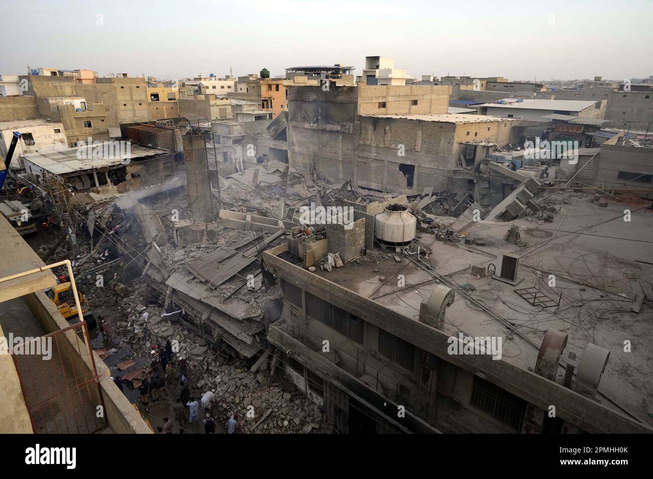 Peshawar, Pakistan, April 13, 2023. Rescue officials are busy in rescue operation after a ...
