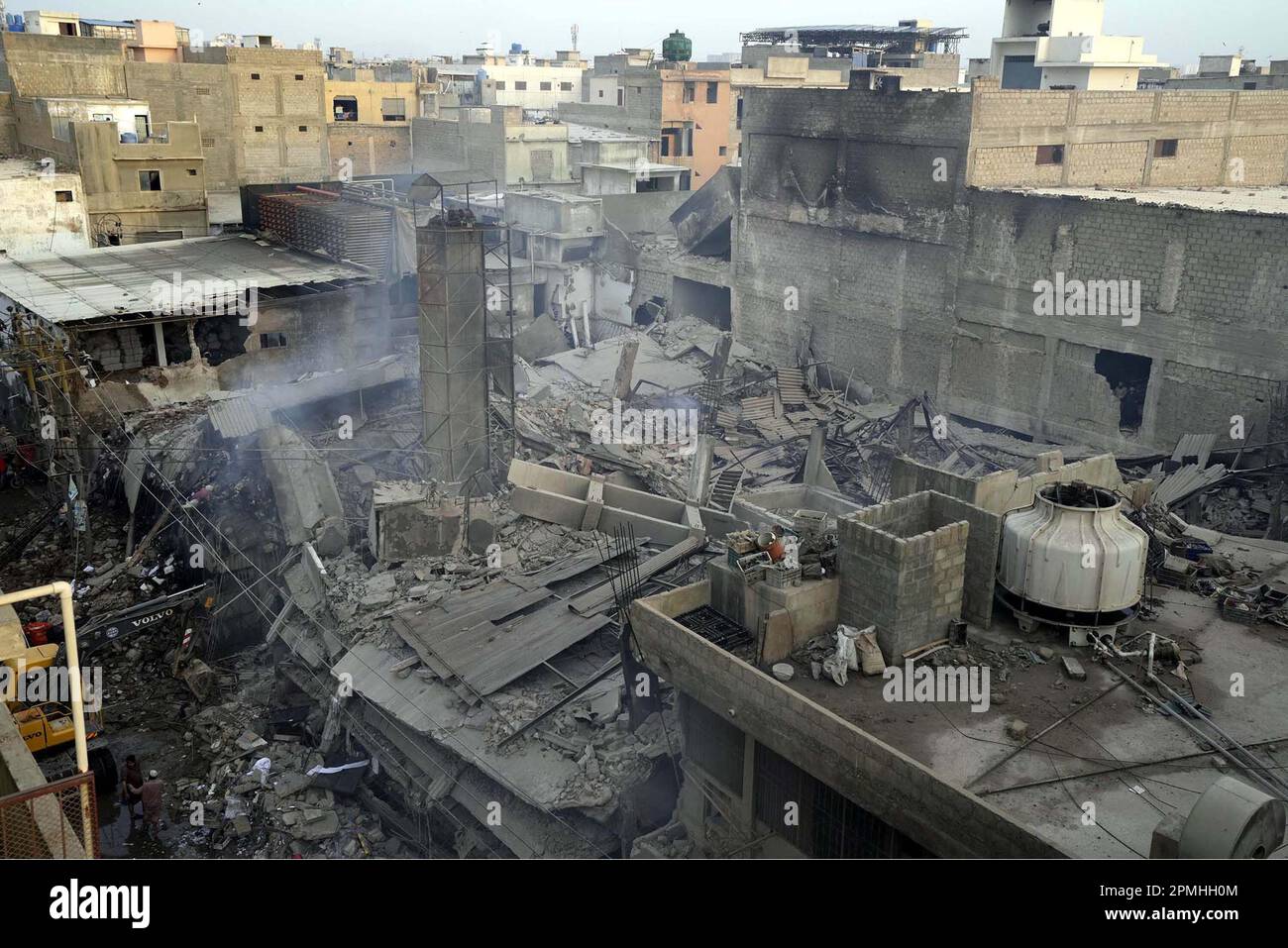 Peshawar, Pakistan, April 13, 2023. Rescue officials are busy in rescue operation after a ...