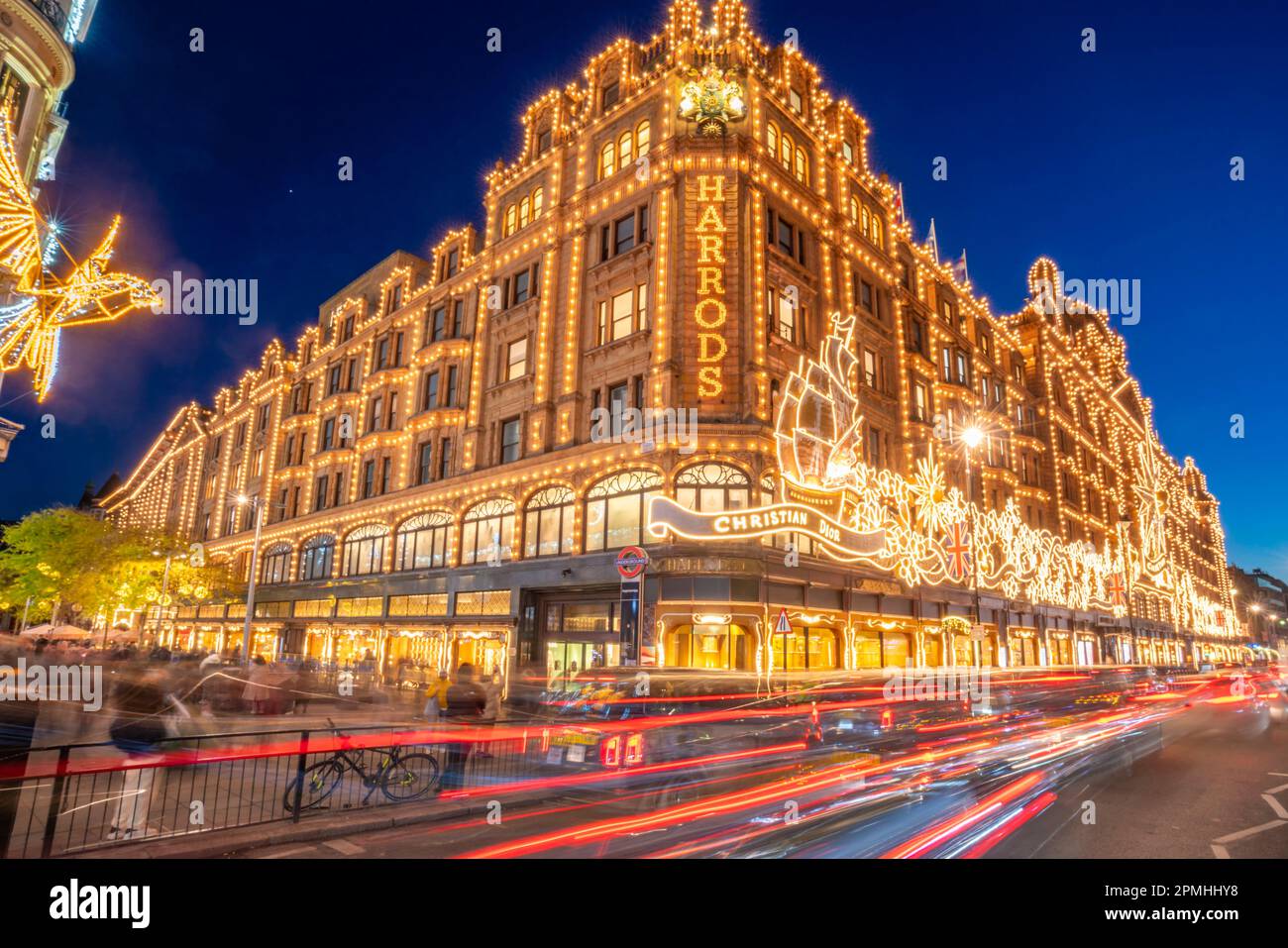 View of Harrods department store illuminated at dusk, Knightsbridge ...