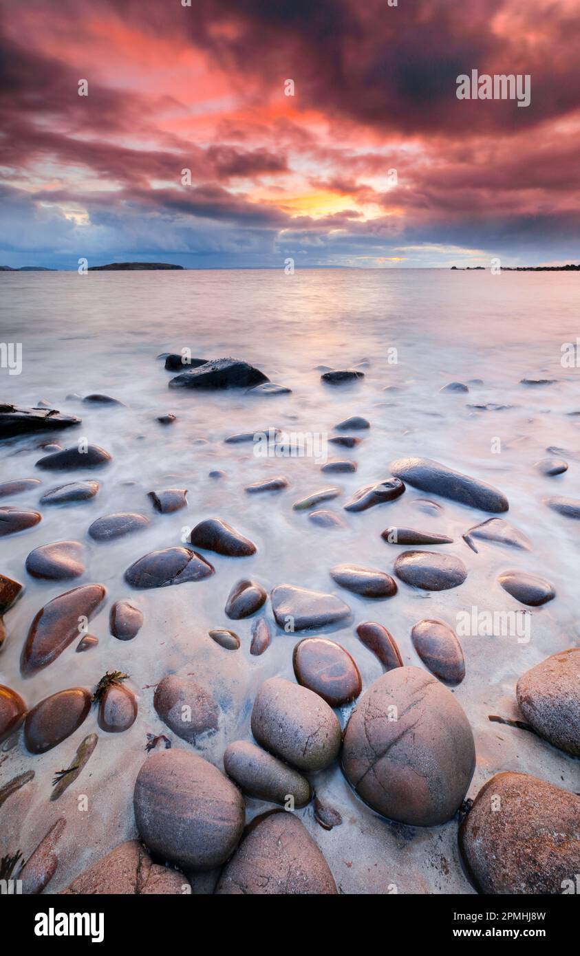 Rocks and sandy beach at Reiff Bay with the Summer Isles in the ...