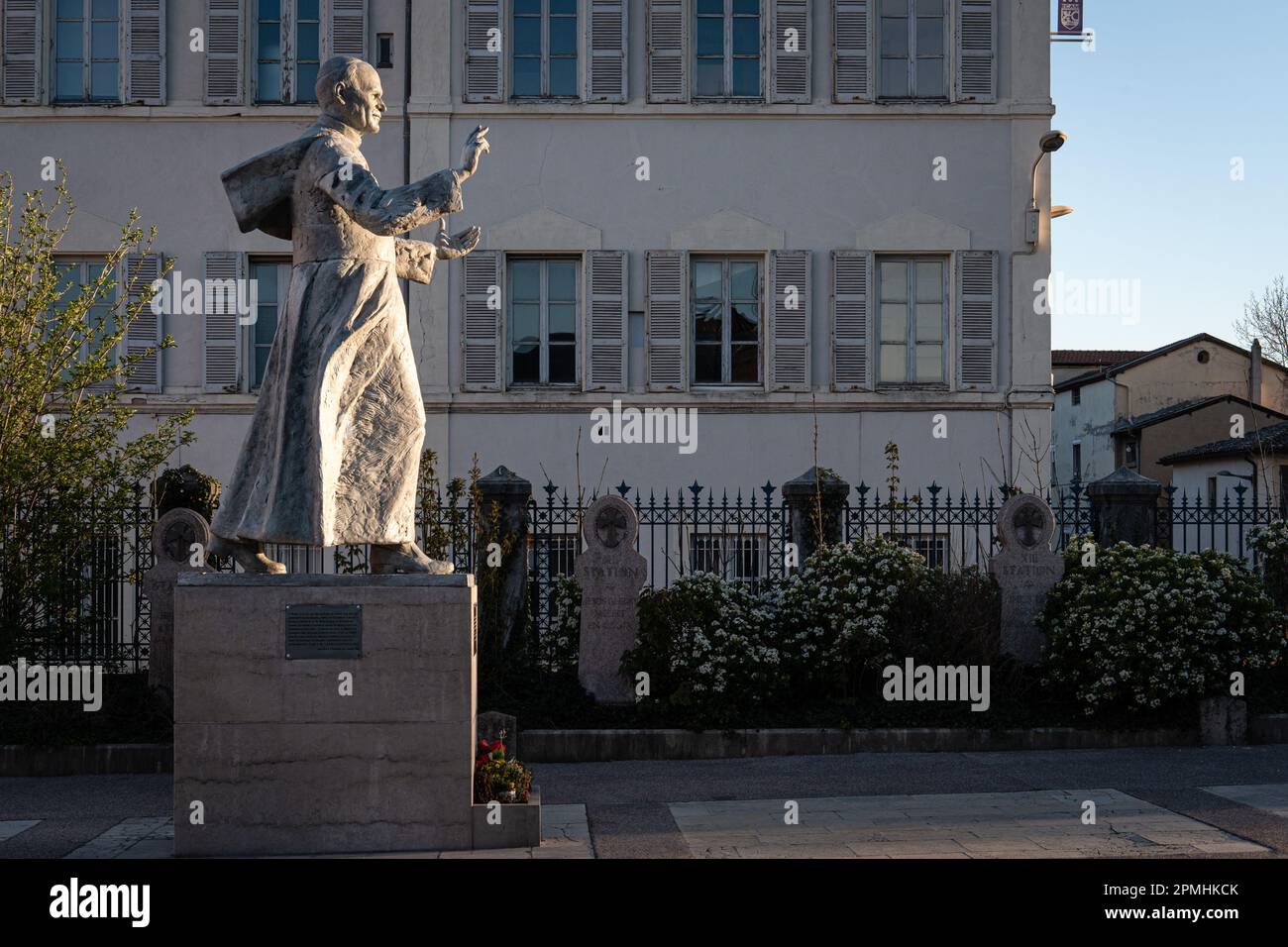 France, Lyon, 2023-04-05. The statue of Pope John Paul II illuminated ...