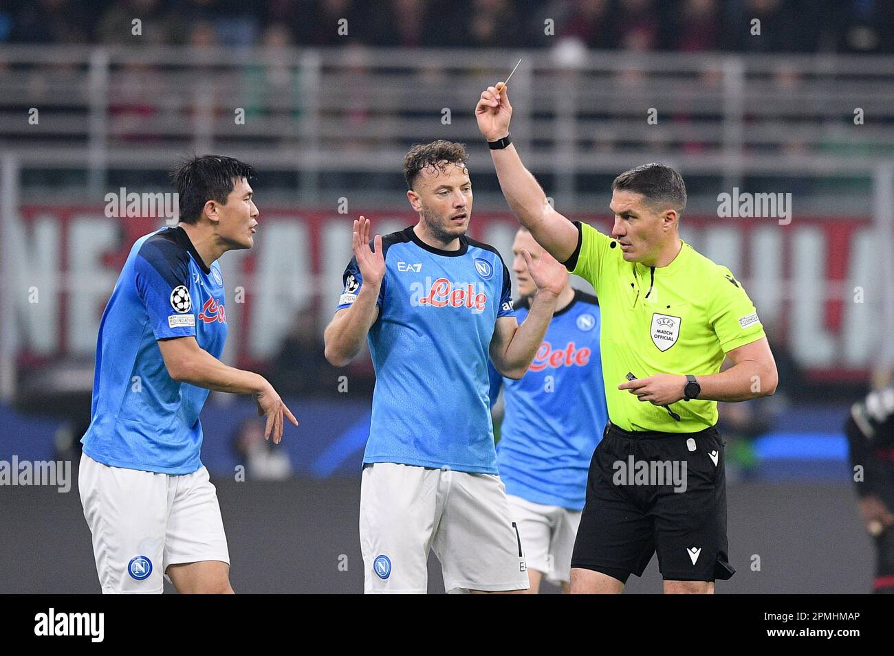 Milan, Italy. 12th Apr, 2023. Referee Istvan Kovacs shows a yellow card ...