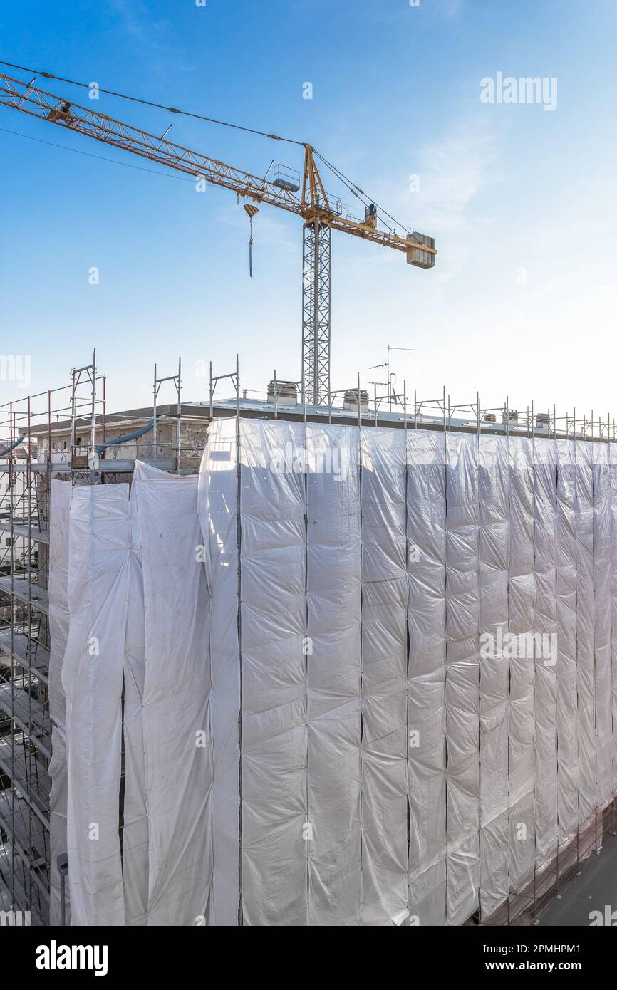 Extensive scaffolding providing platforms for work in progress on a new ...