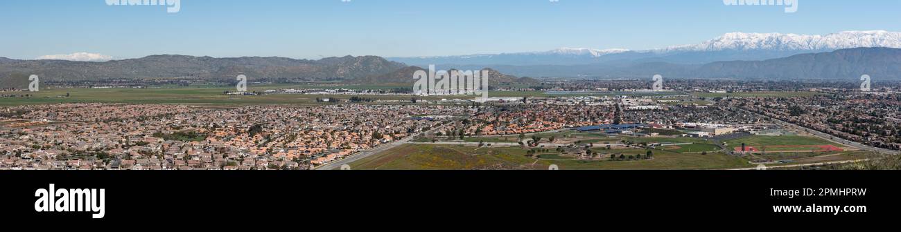 Panorama of the city of Hemet California with snow covered mountains in ...